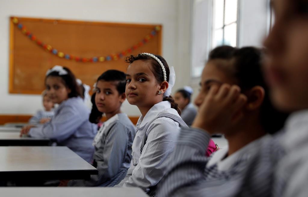 Gaza students back to school with few virus safety measures
