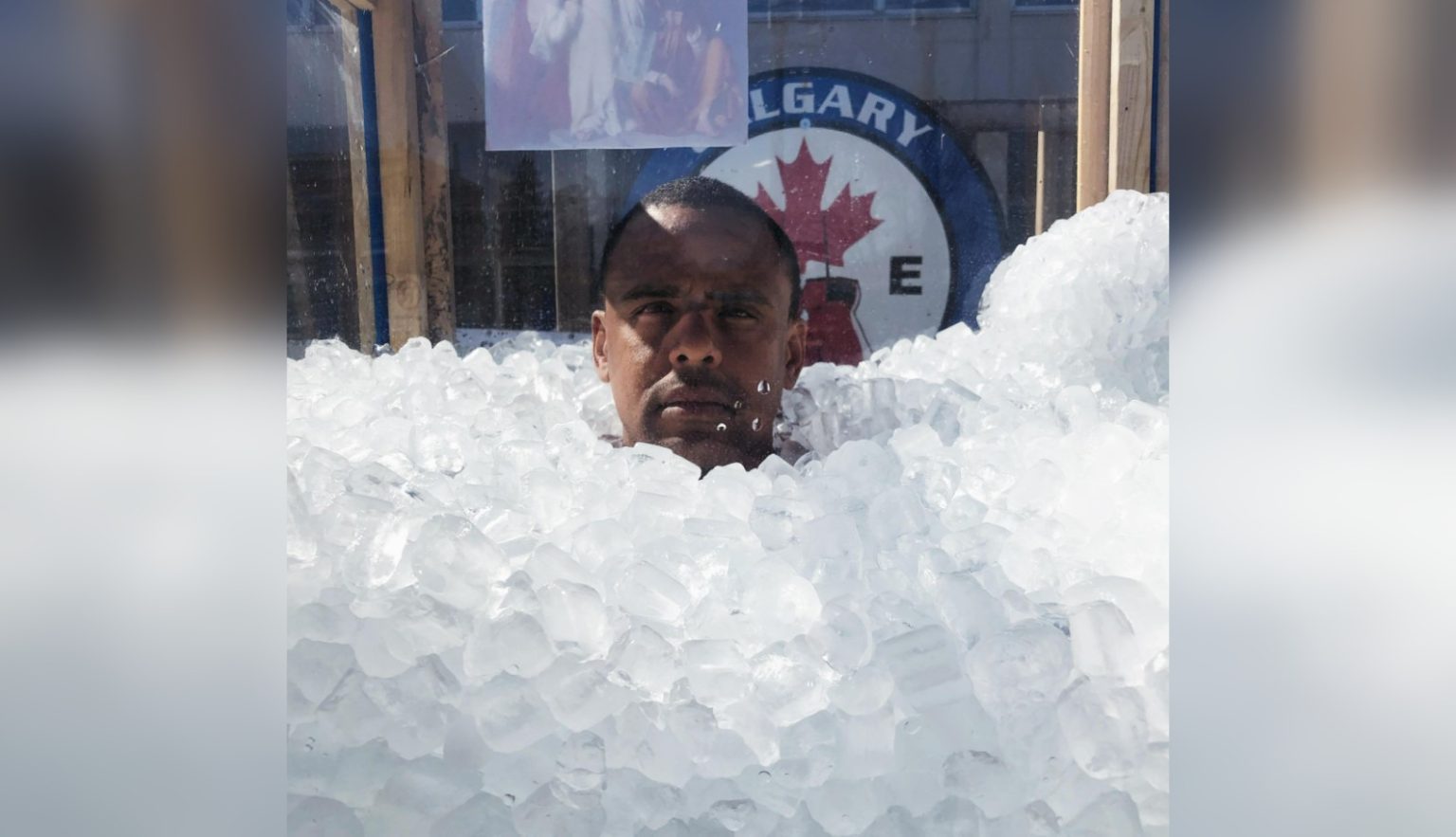 Athlete spends hours submerged in ice in Calgary to break record