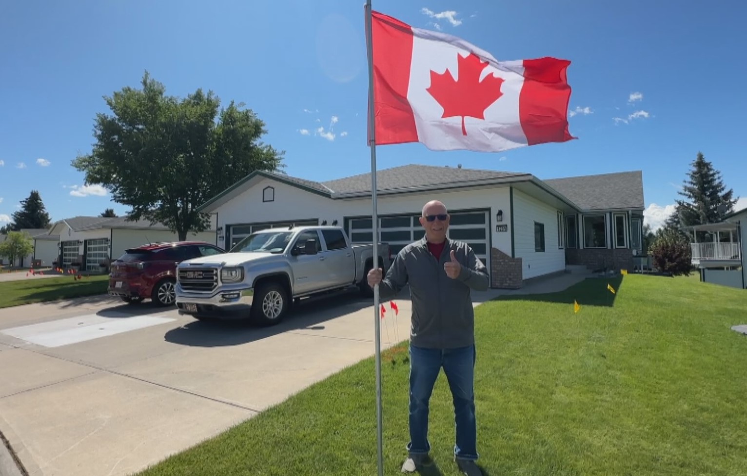 Alberta residents feel patriotic flying Canadian flags outside homes